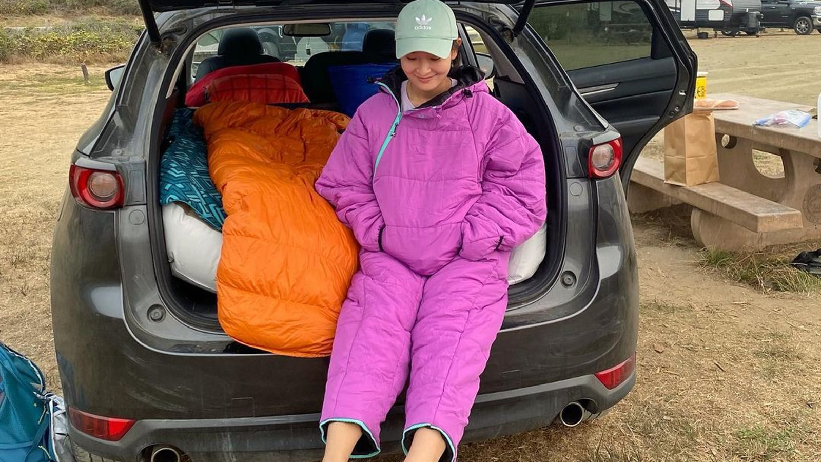 TikTok's Viral Wearable Sleeping Bag Is The Most Unexpected (& Sustainable) Fashion Trend